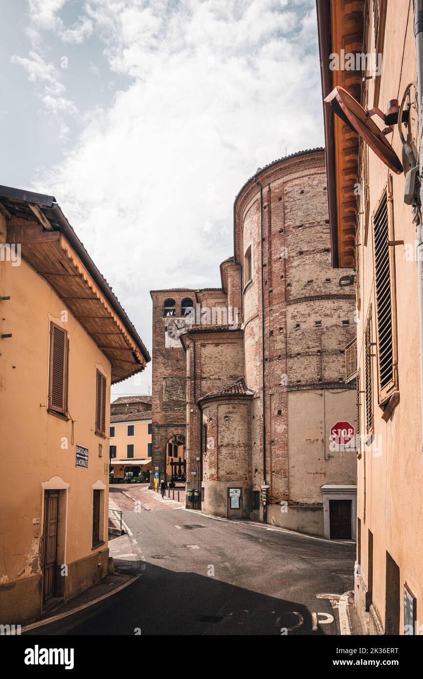 A vertical shot of a narrow street between ancient buildings Stock ...