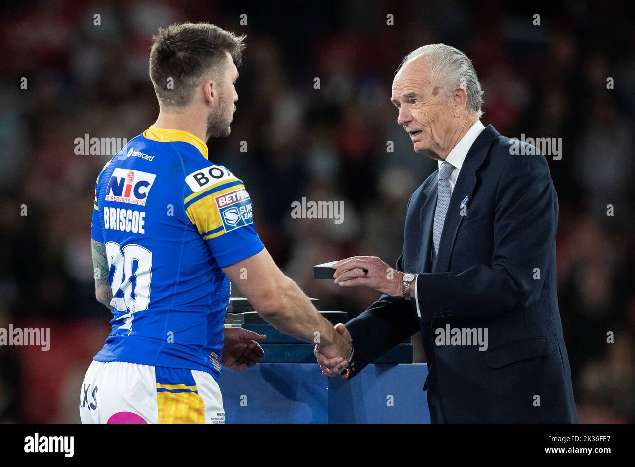 Tom Briscoe #20 of Leeds Rhinos is presented with the runners up medal ...