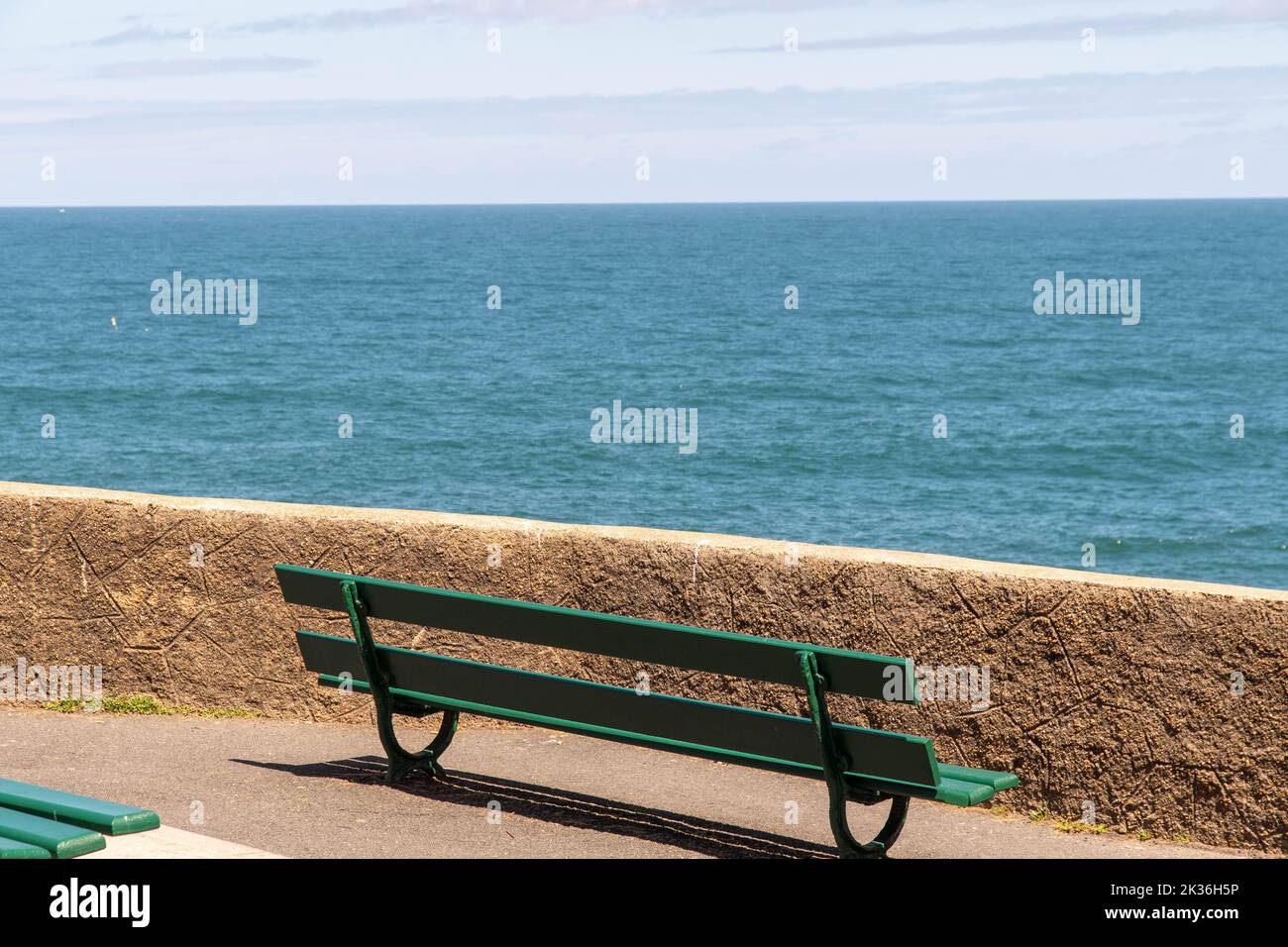 Empty bench on the beach with a view of the Atlantic Ocean Stock Photo ...