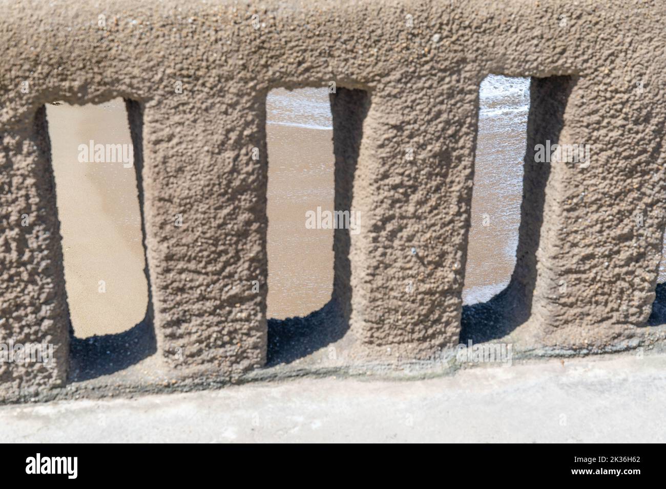 Stone bridge railing with narrow views through it Stock Photo - Alamy