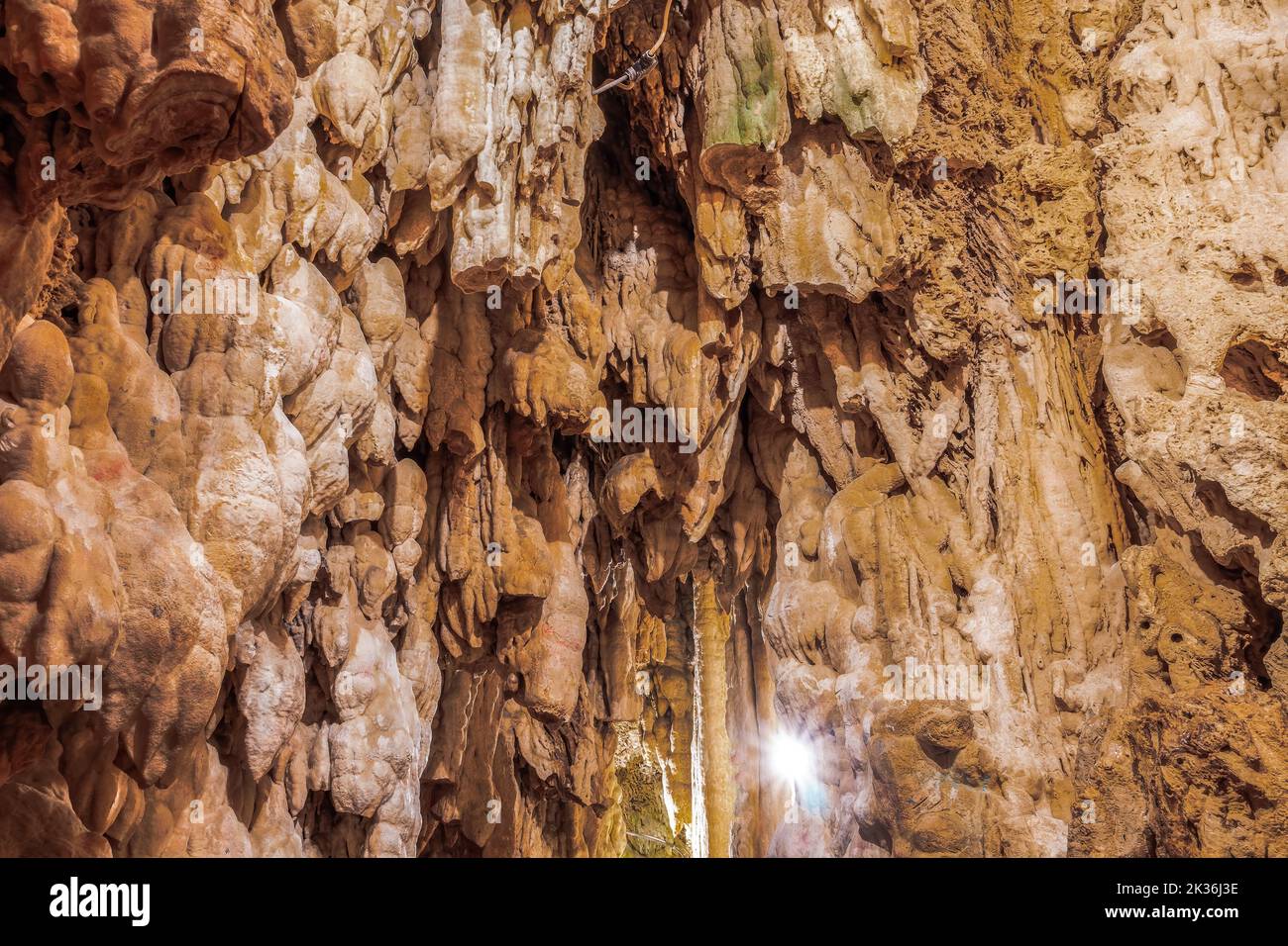 Limestone stalactites mineral formation hanging from the ceiling inside ...