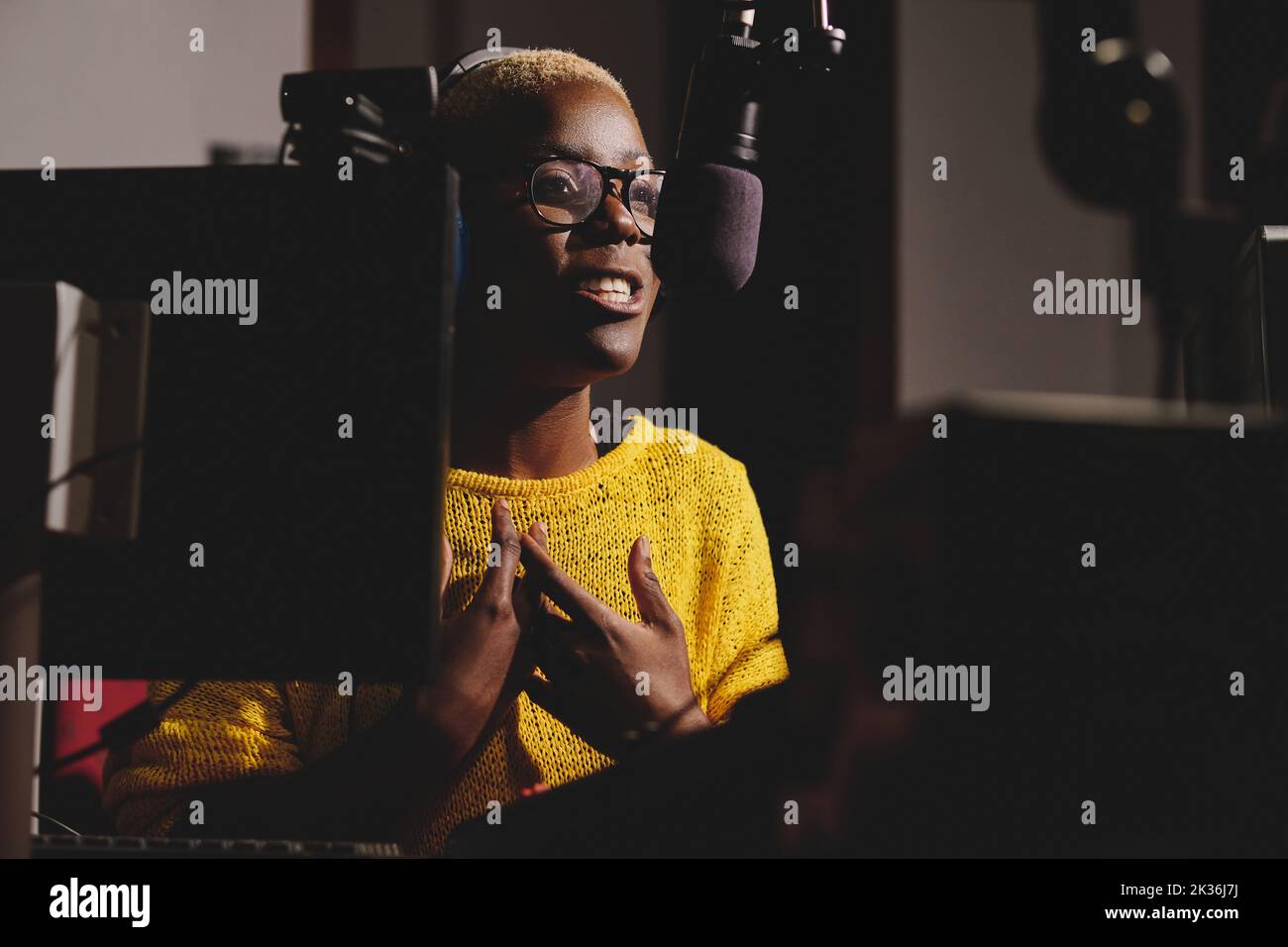 Speaking into radio microphone hi-res stock photography and images - Alamy