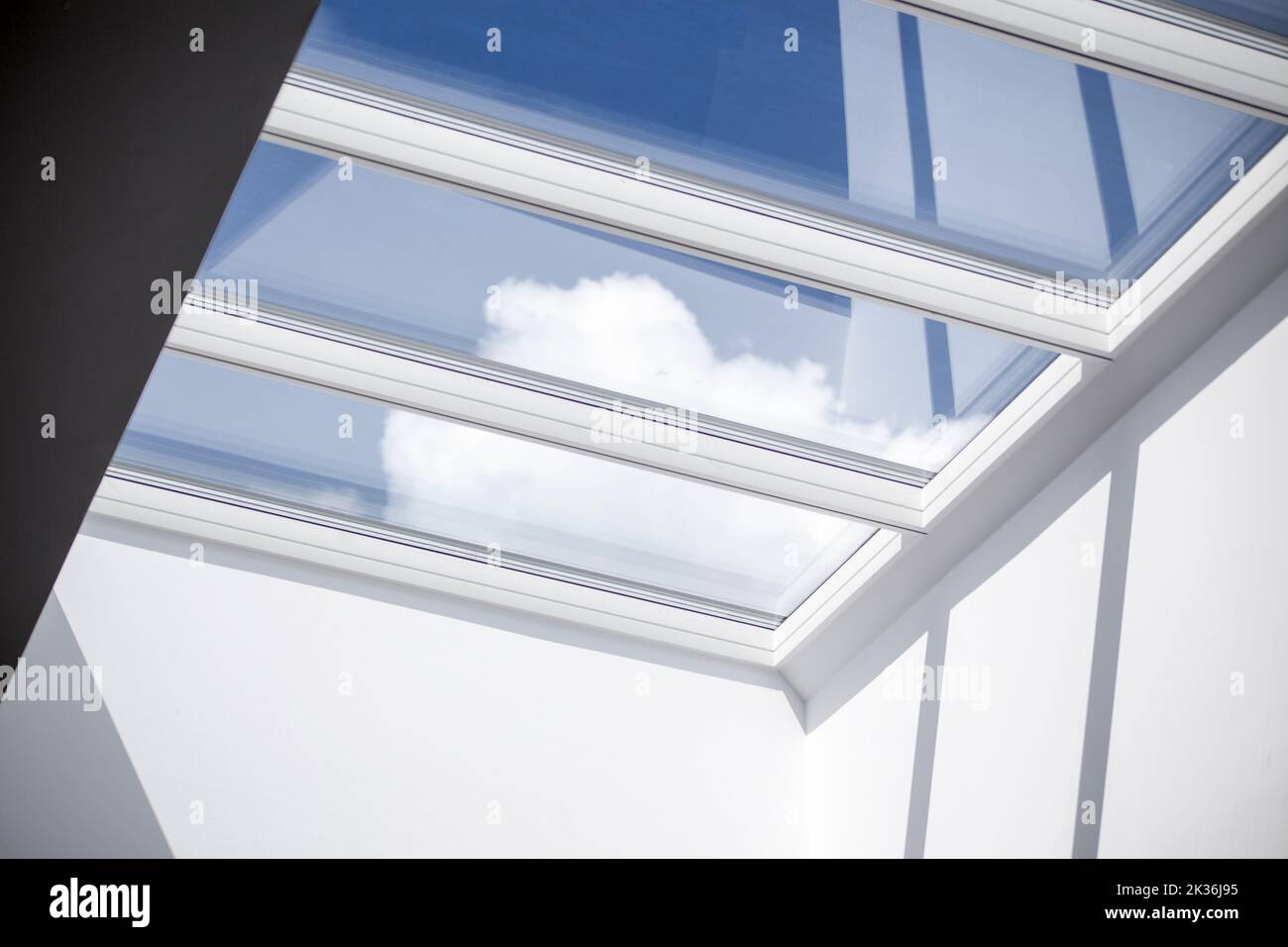 A low angle shot of a ceiling window with a sky view Stock Photo - Alamy