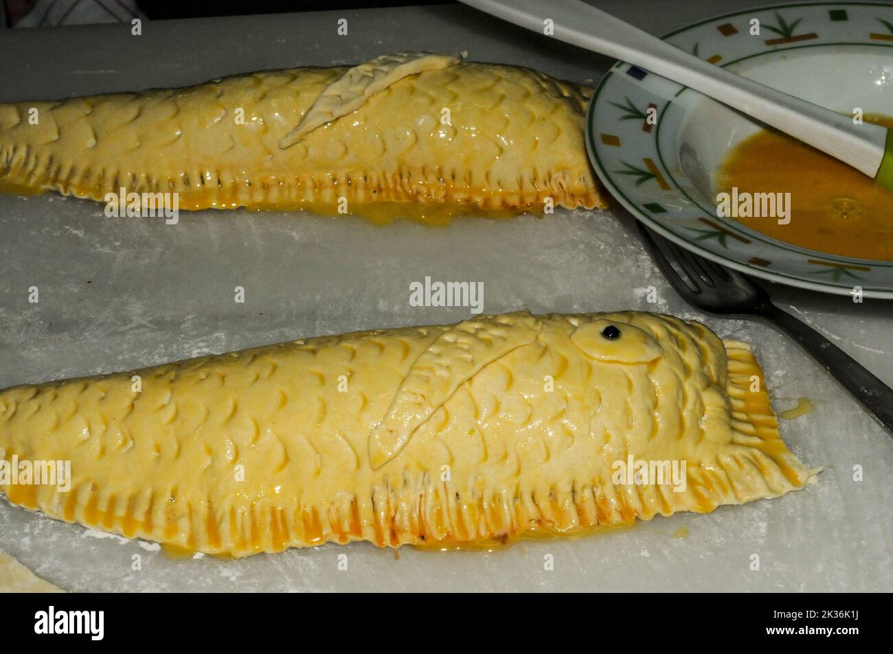 Stuffed whiting wrapped in a decorated sheet of puff pastry Stock Photo ...
