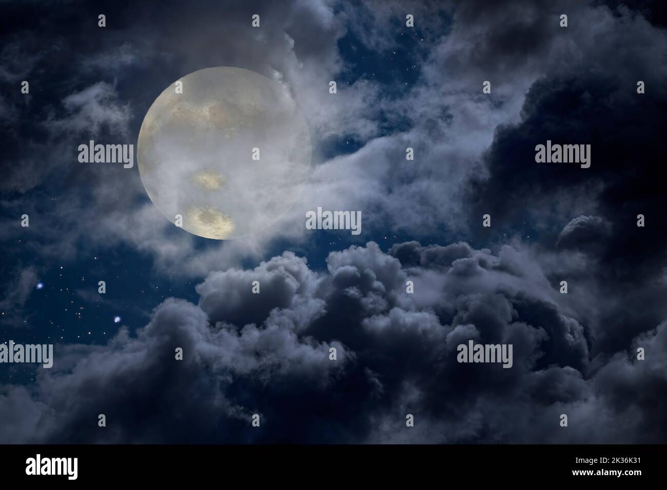 Cloudy full moon night with stars Stock Photo - Alamy
