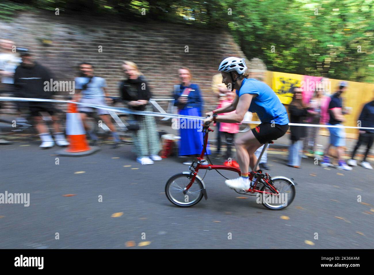 Katherine Forrest (rider No. 336), riding a Brompton folding bike ...