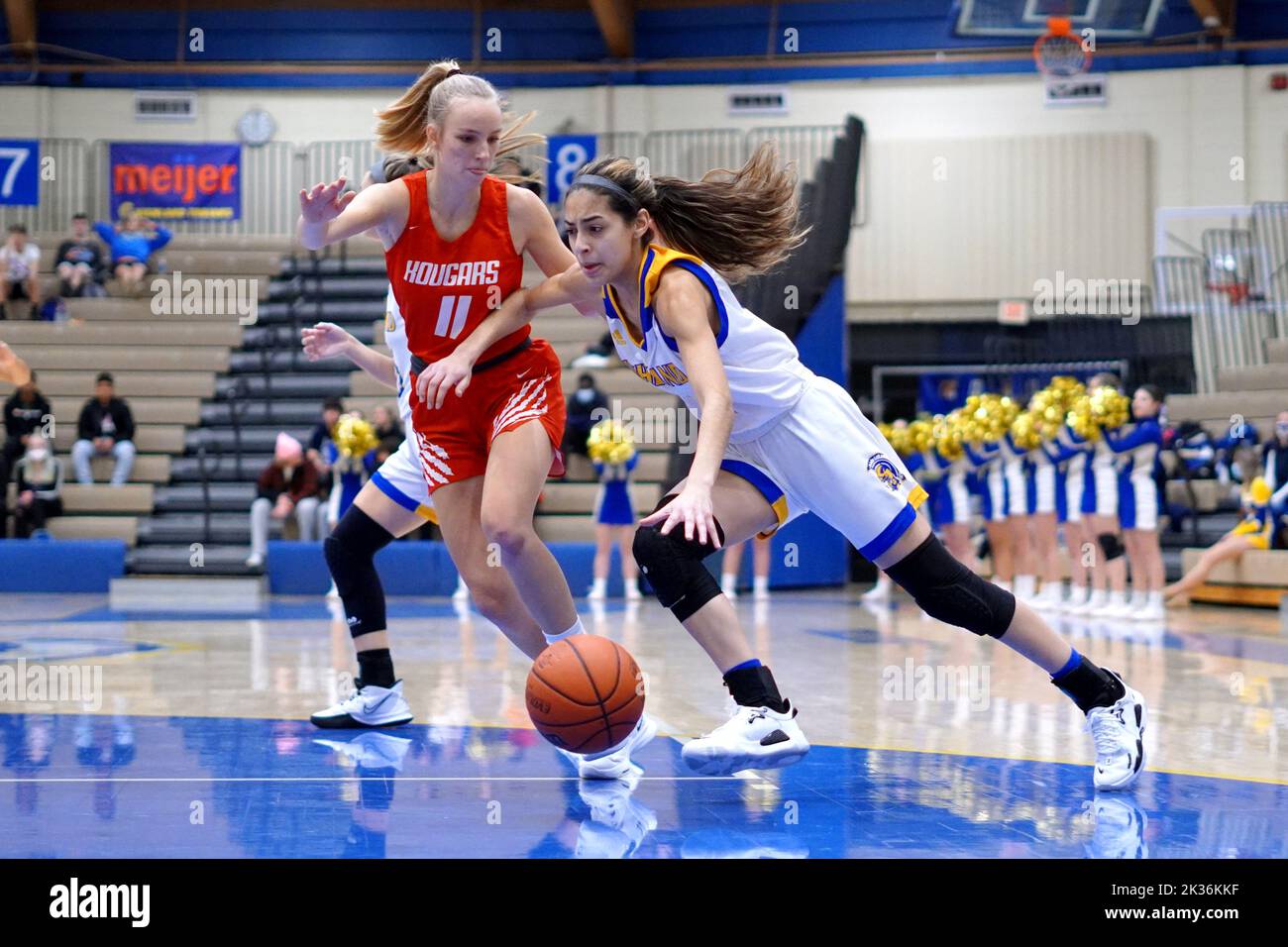 The female team players of Highland vs Kankakee playing on an indoor ...