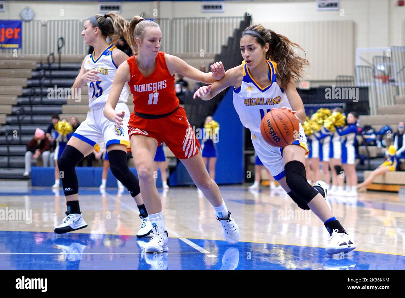 The female team players of Highland vs Kankakee playing on an indoor ...