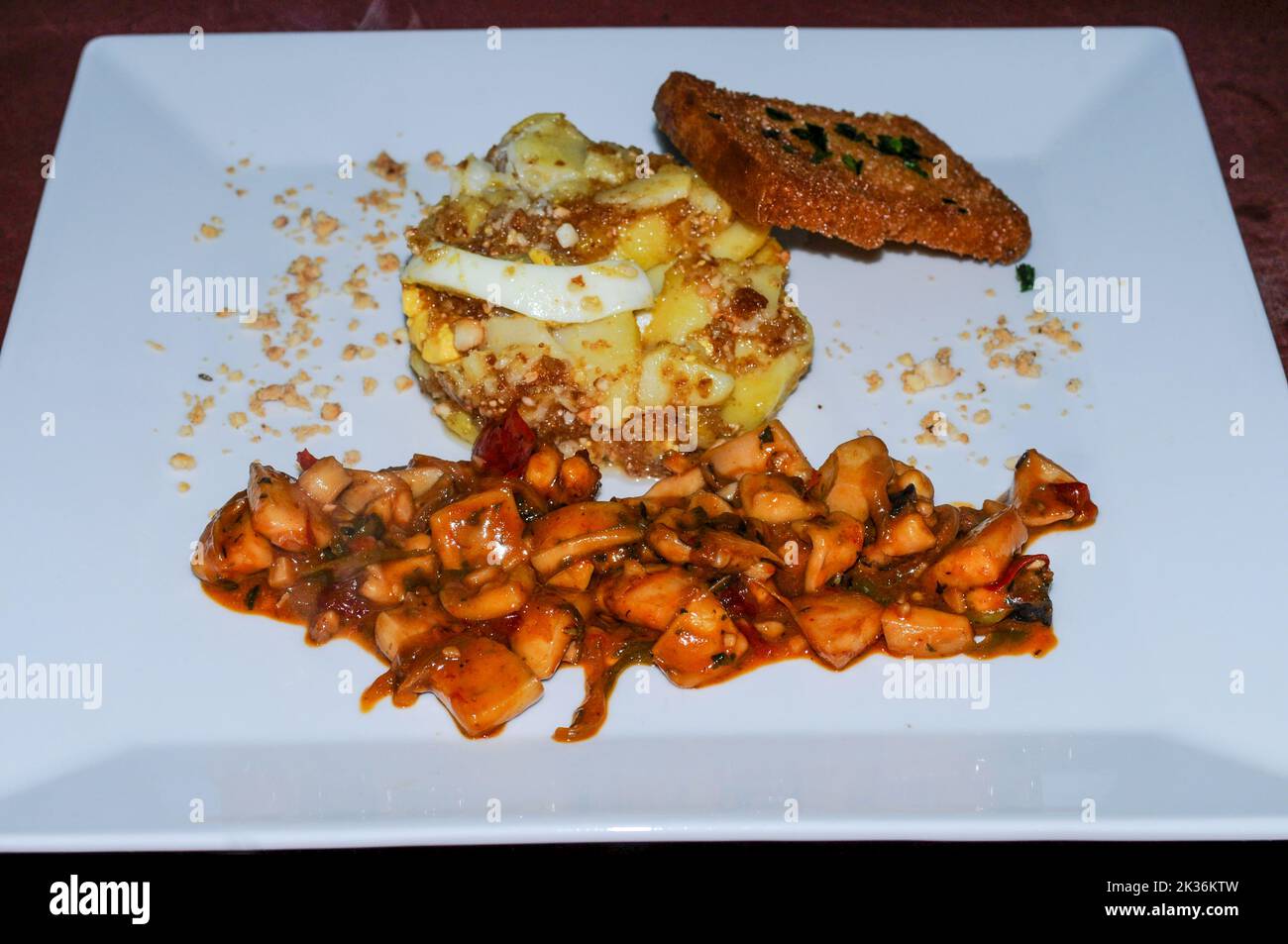 Traditional French recipe of tender and delicious squid stewed in ...