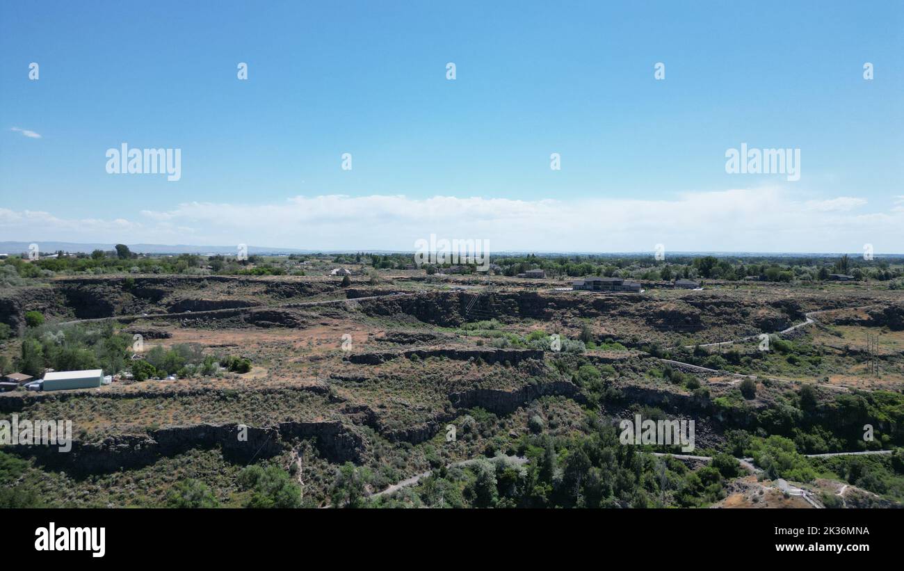 A beautiful landscape of greenery on rocks on a sunny day Stock Photo ...