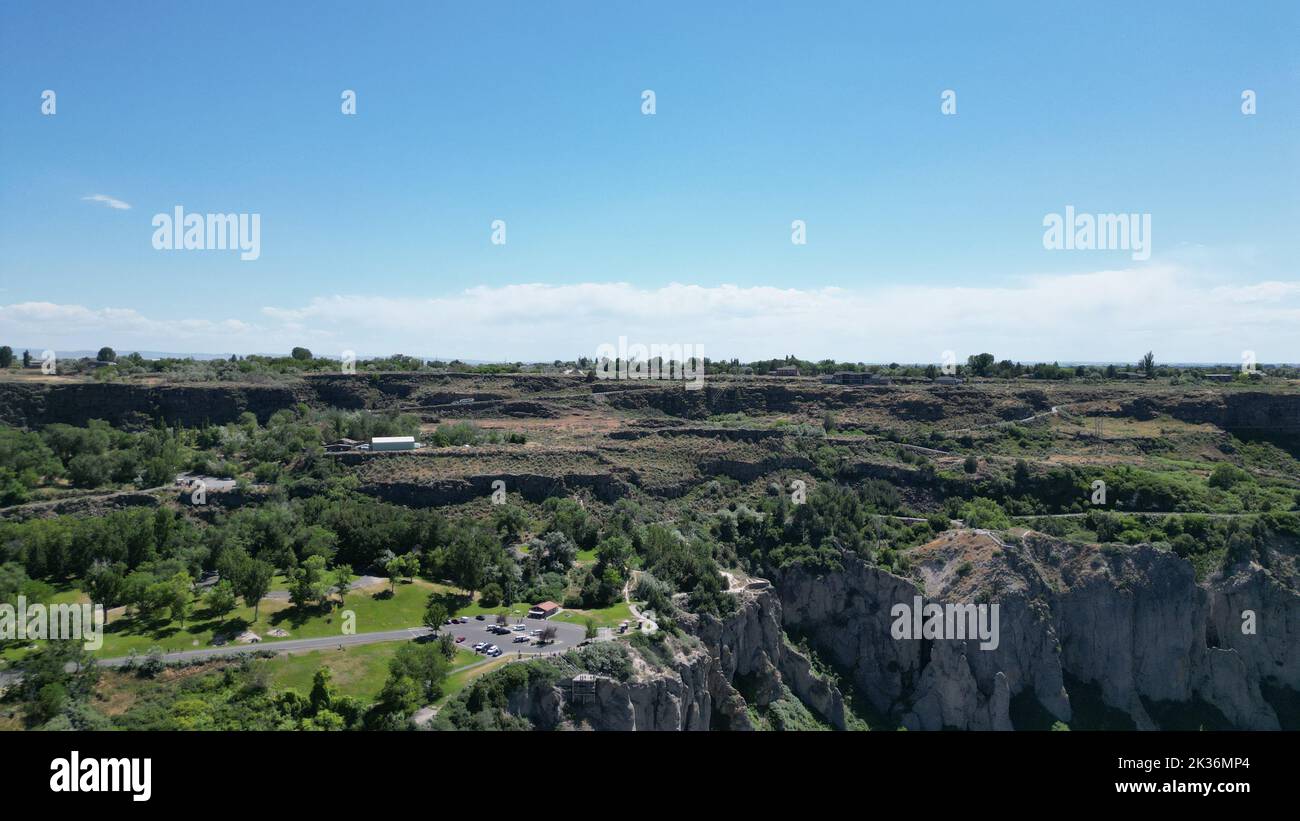 A beautiful landscape of greenery on rocks on a sunny day Stock Photo ...