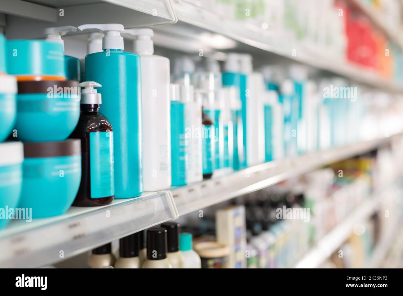 Hair care products on store shelves in supermarket Stock Photo - Alamy