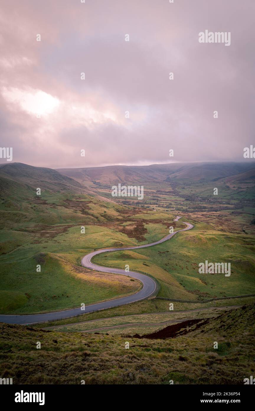 A vertical of a meandering mountain trail captured from a height under ...