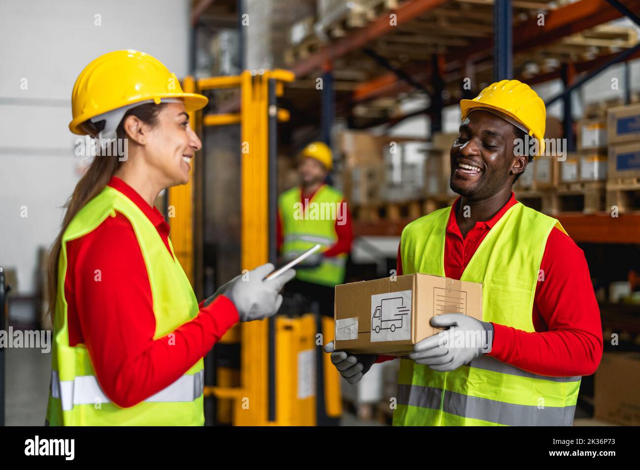 Happy multiracial people working inside logistic warehouse Stock Photo ...