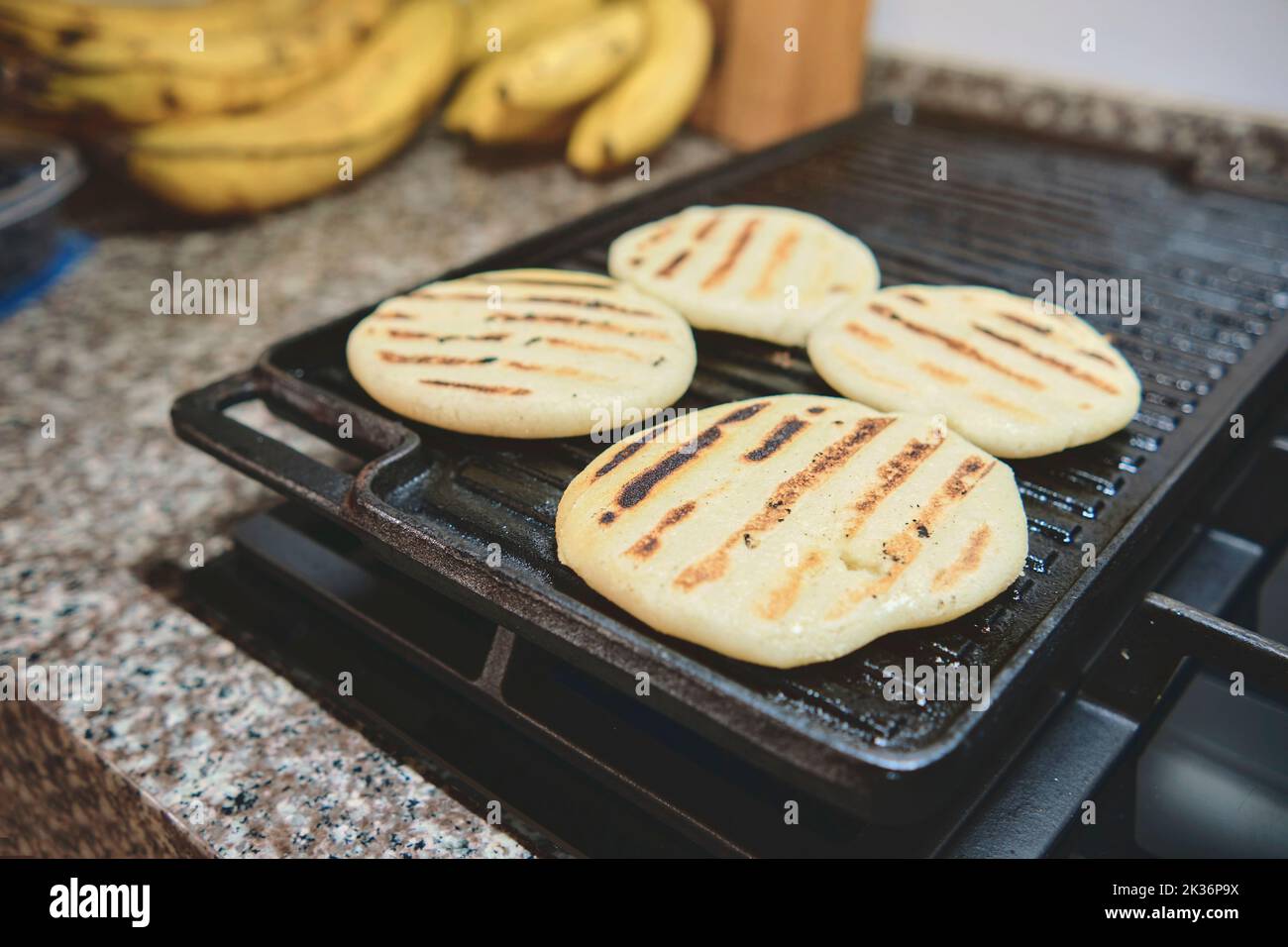 Arepa made from ground corn dough, cornmeal, traditional in the cuisine ...