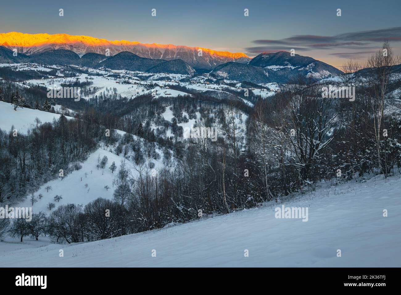 Stunning winter dawn scenery with high snowy mountains. Magical sunrise ...