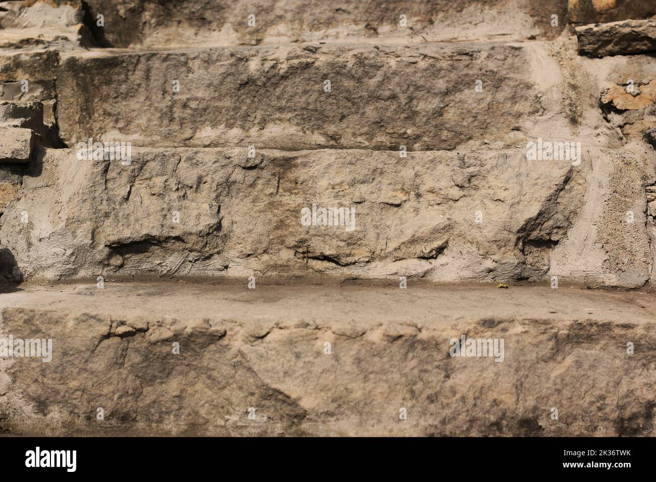Ancient uneven stone stairs with weathered steps Stock Photo - Alamy