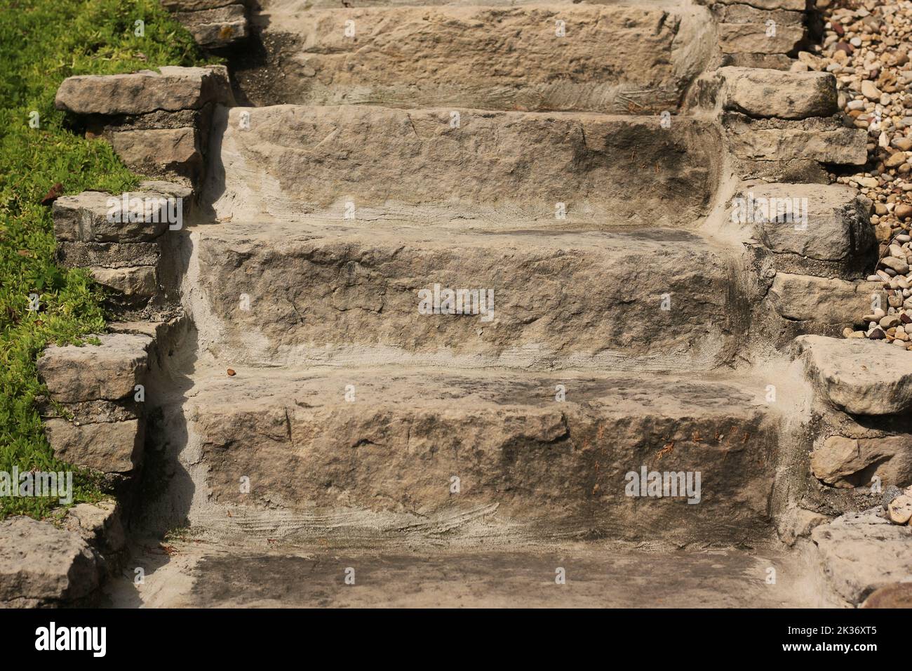 Ancient uneven stone stairs with weathered steps Stock Photo - Alamy