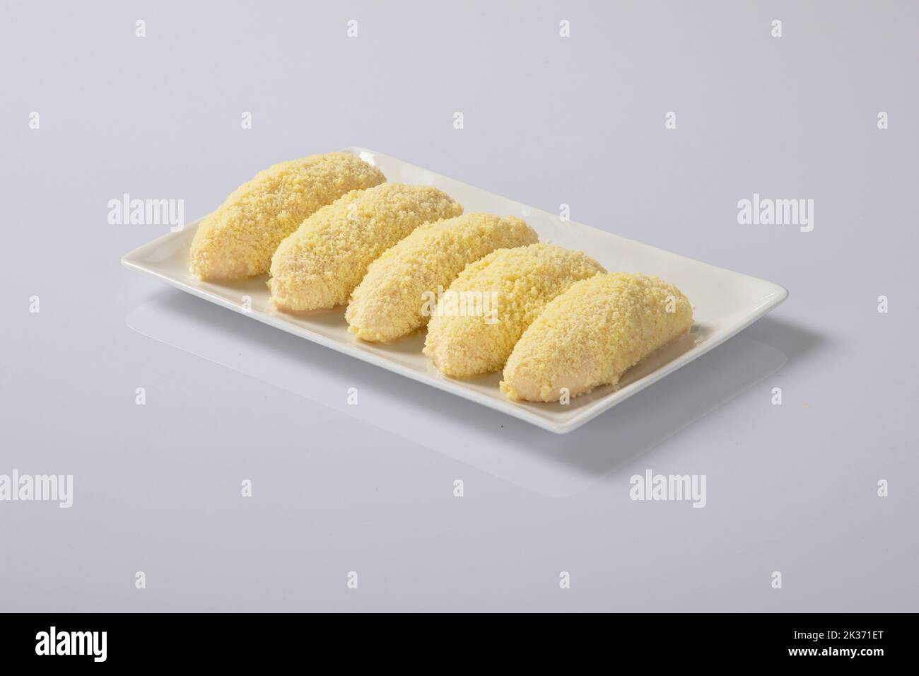 Plate with traditional Indian sweets – laddu, gulab jamun, gujiya ...