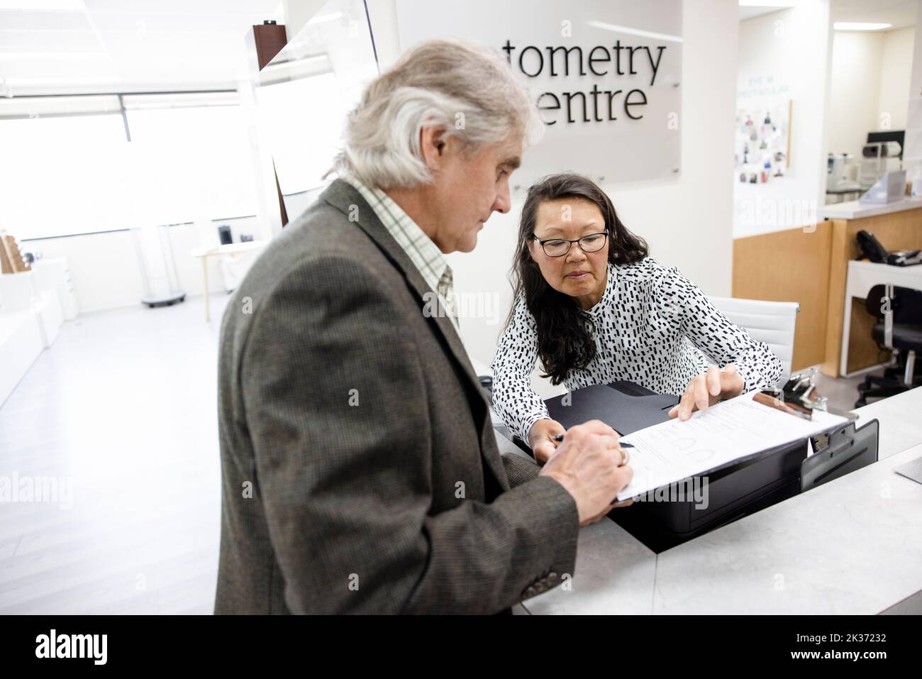 Helping with form hi-res stock photography and images - Alamy