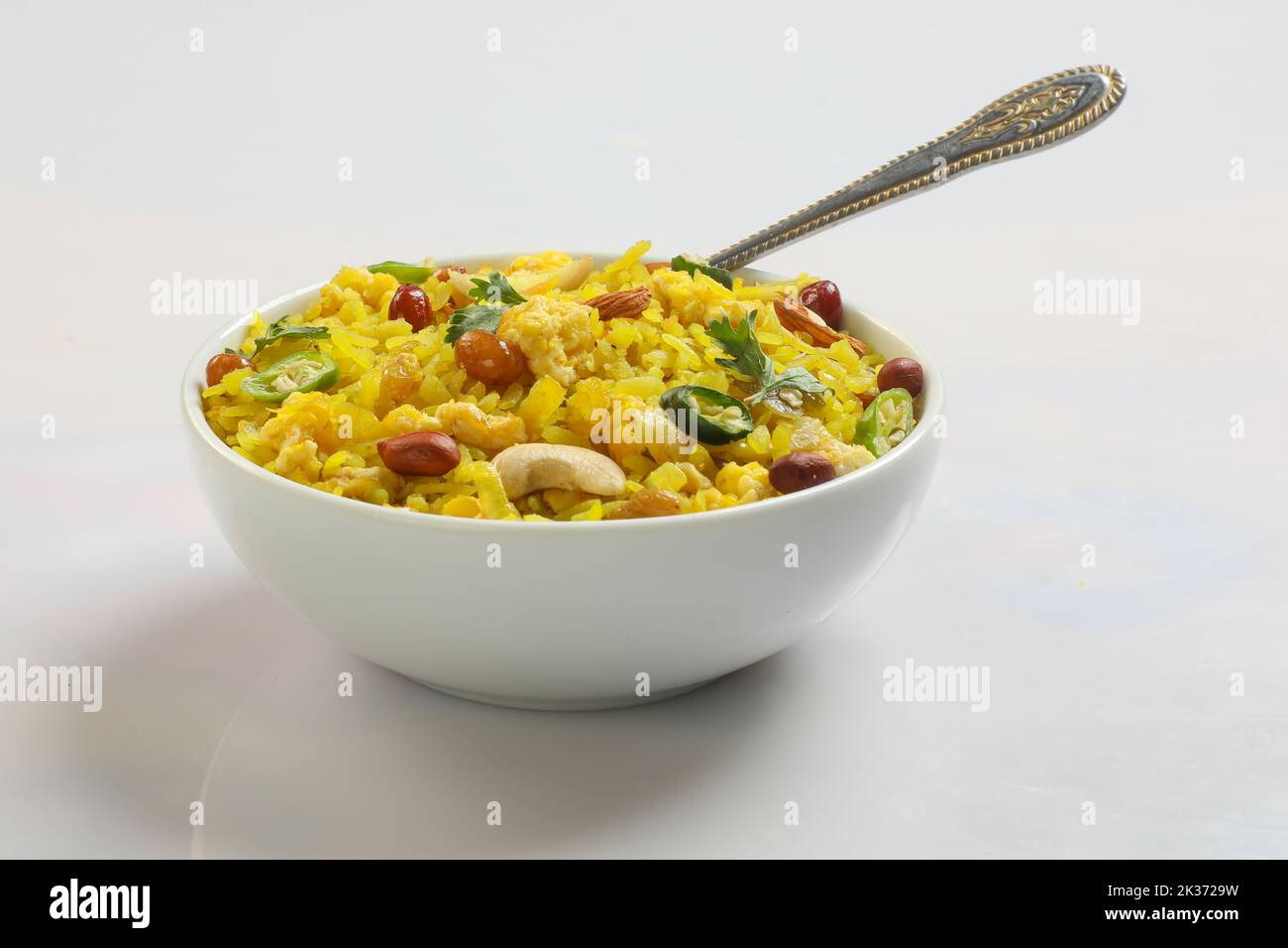 indian breakfast dish poha.Indian breakfast Poha topped with peanuts ...