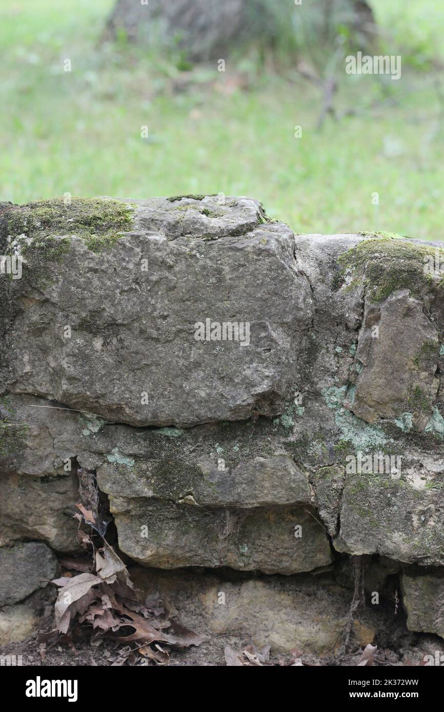 An old weathered stone fence crumbling from the years of use Stock ...