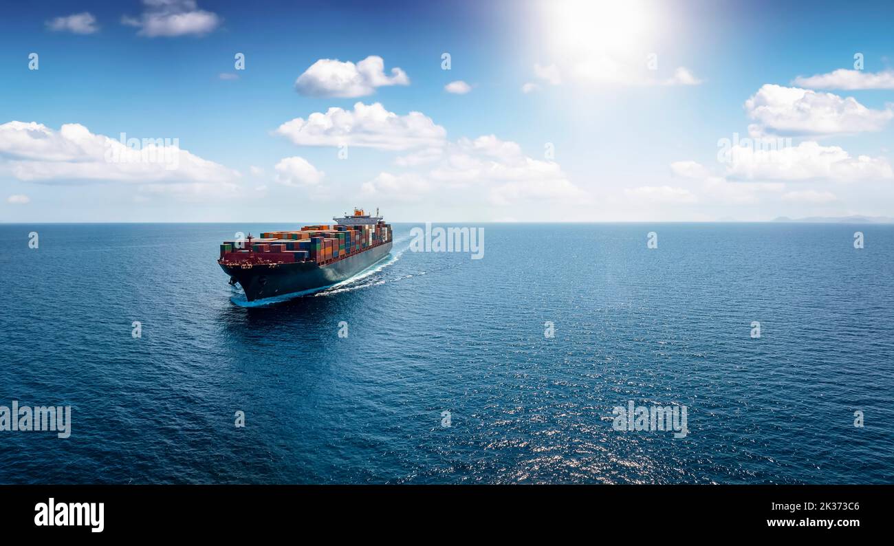 Panoramic front view of a cargo ship carrying containers Stock Photo ...