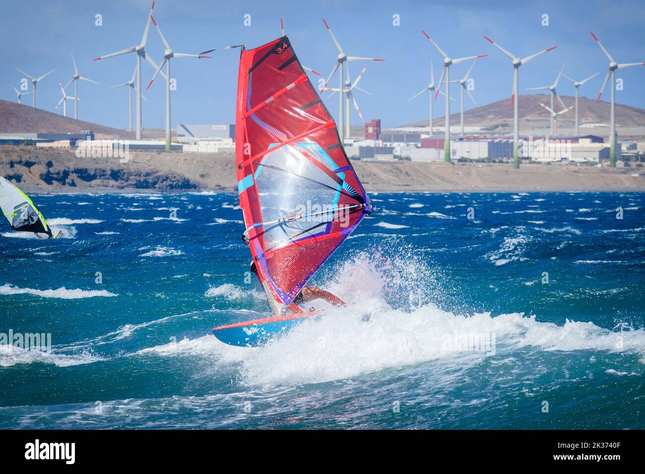 Windsurfing at Pozo izquierdo beach with a red sail, Santa Lucia de ...