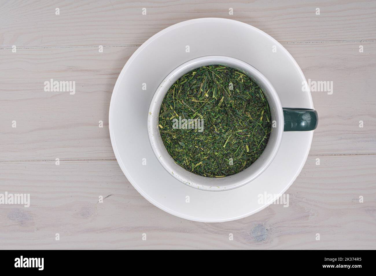 Top view green tea cup on white wooden background Stock Photo - Alamy