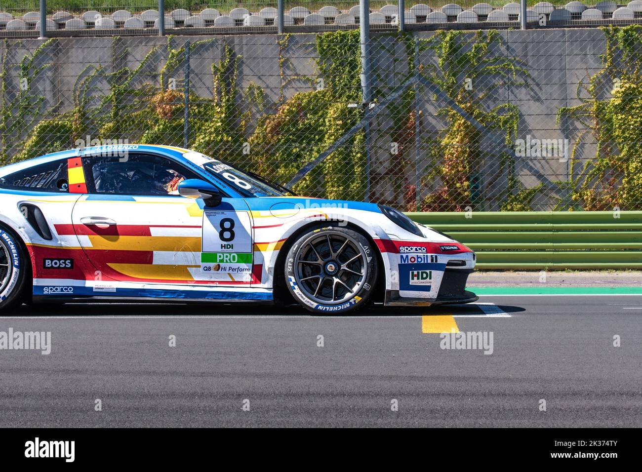 Porsche Carrera race car standing in racetrack starting grid detail ...