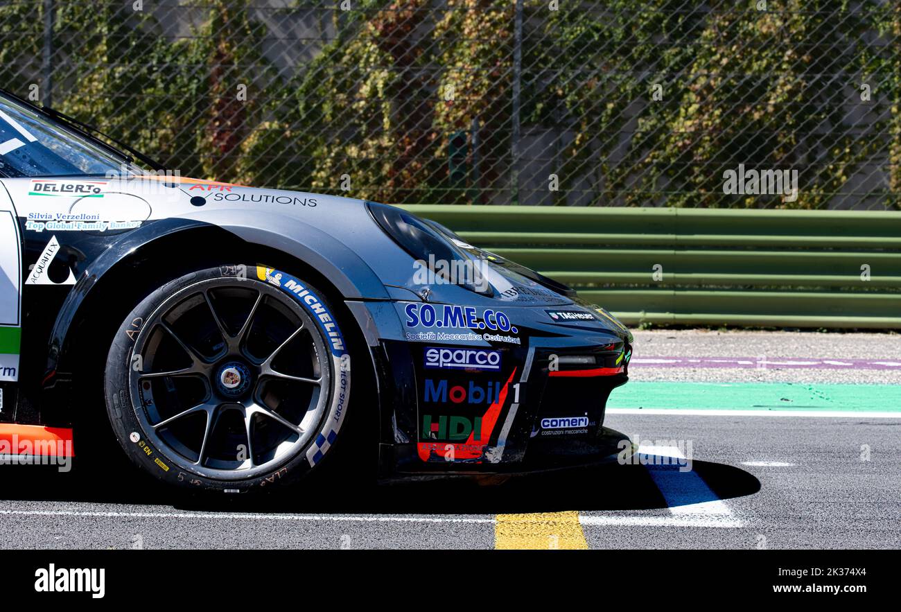 Porsche Carrera race car standing in racetrack starting grid detail ...