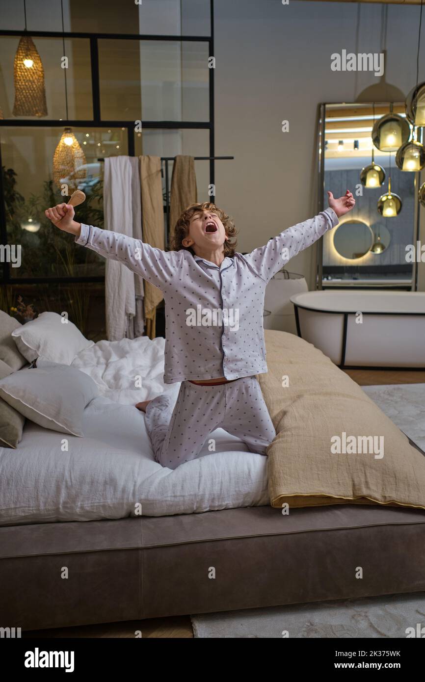 Boy in bed singing hi-res stock photography and images - Alamy