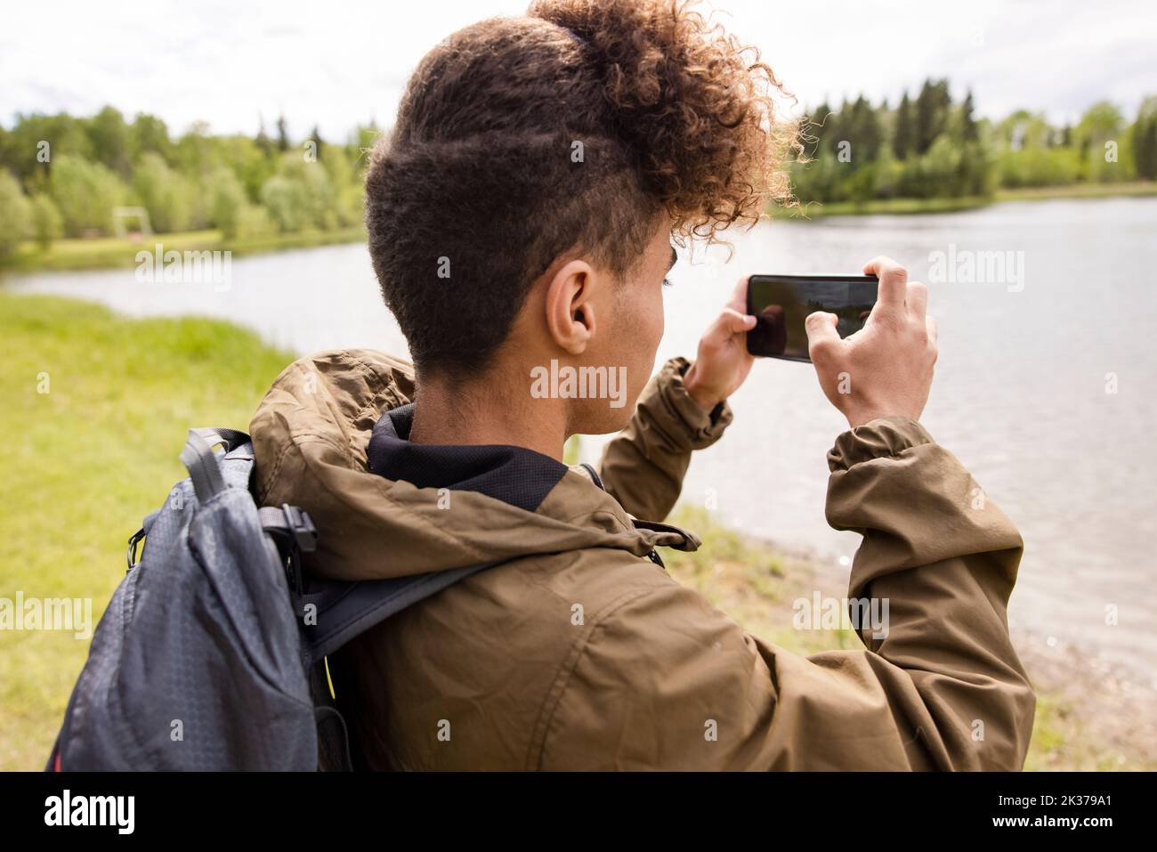 Boy taking photo with phone hi-res stock photography and images - Alamy