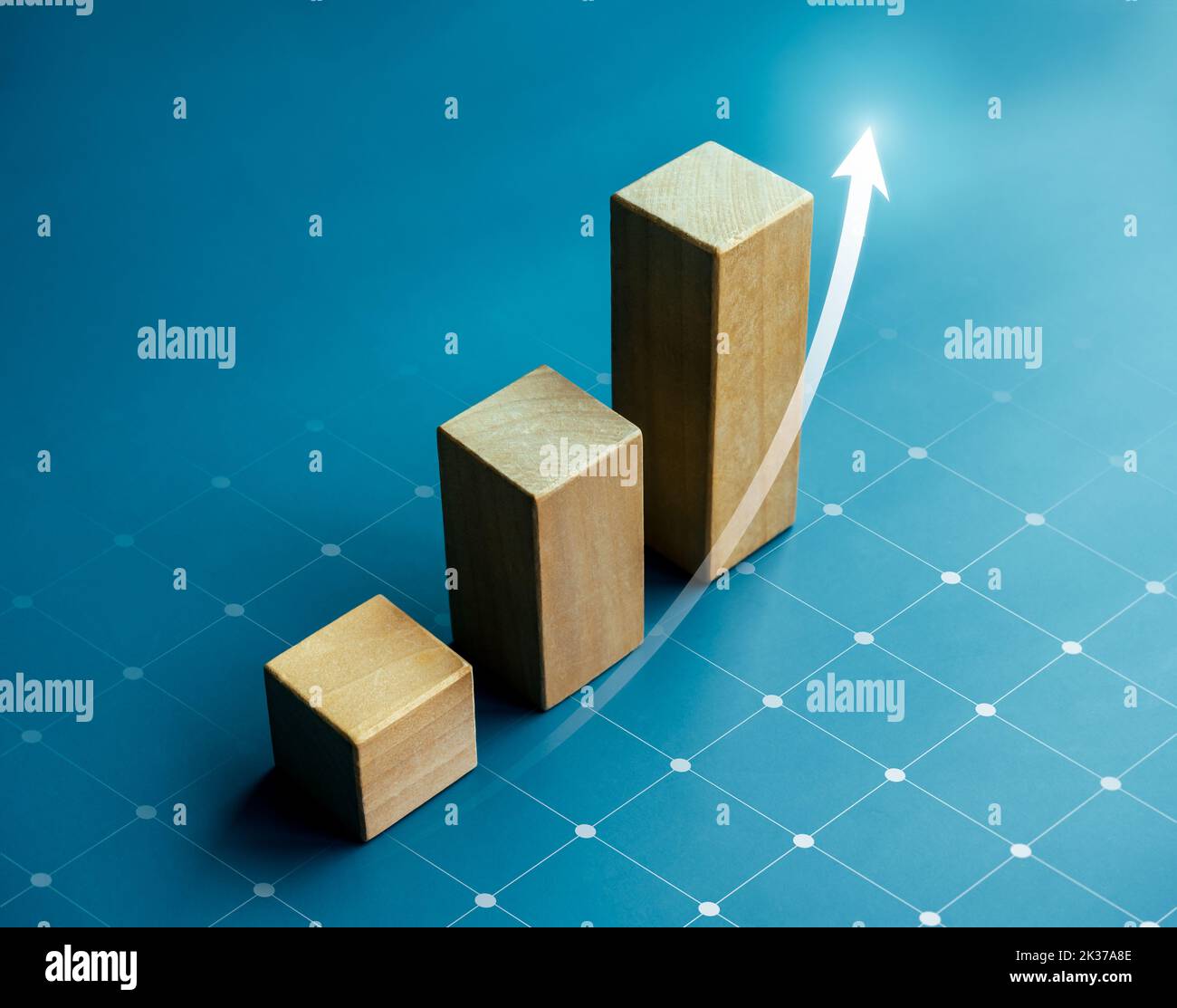 Shining rise up arrow on wooden cube blocks, bar graph chart steps table on blue background ...