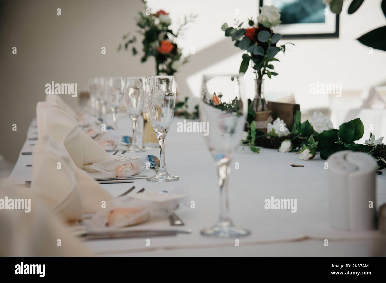 Rustic Wedding Reception Top Table seating with glasses, cutlery and ...