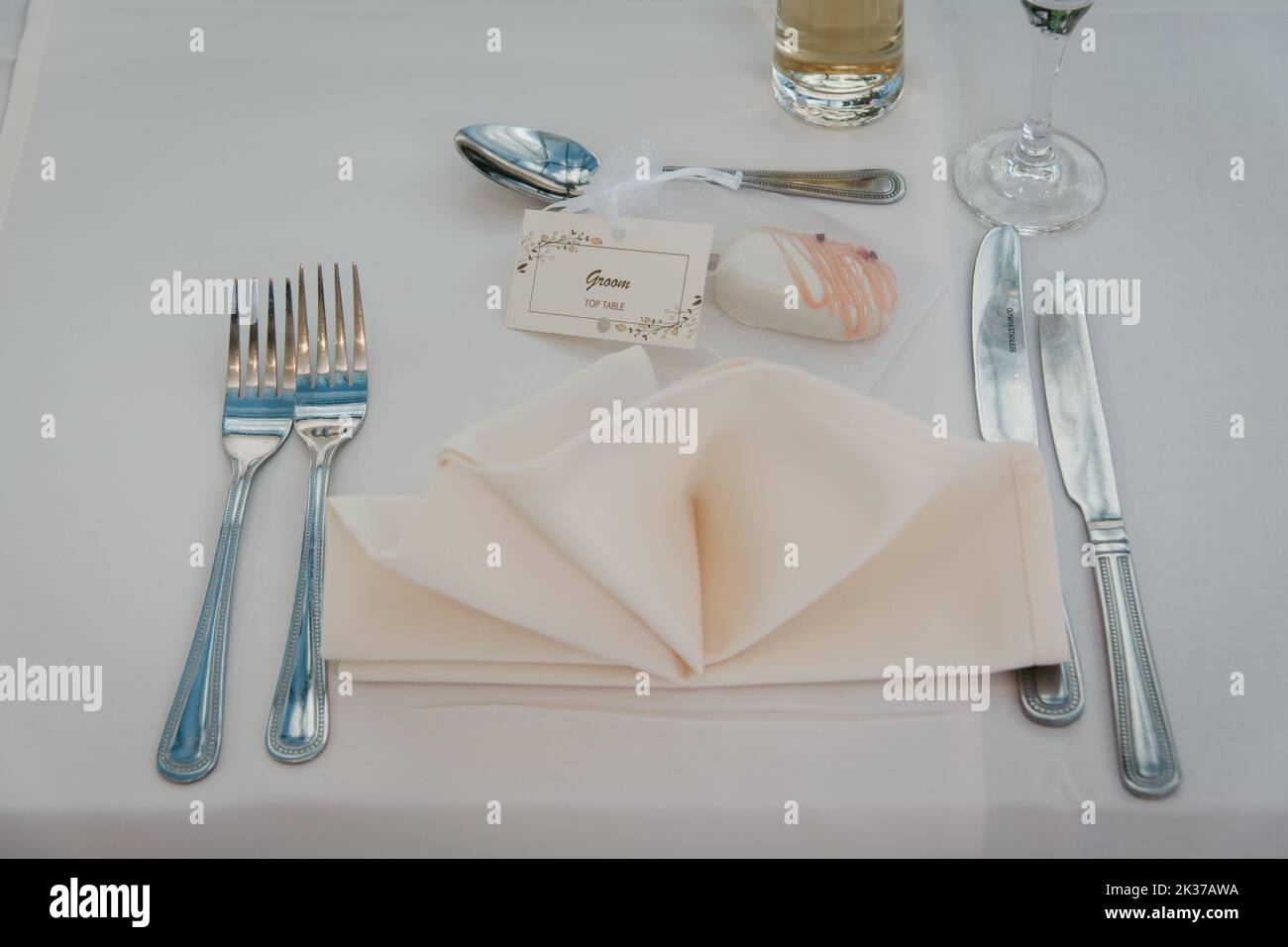 Rustic Wedding Reception Top Table seating with glasses, cutlery and ...