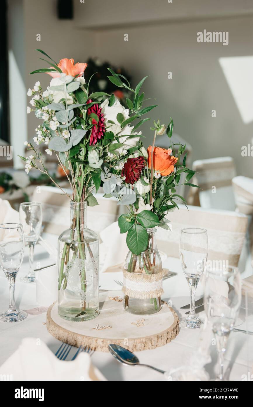 Rustic Wedding Reception Top Table seating with glasses, cutlery and ...