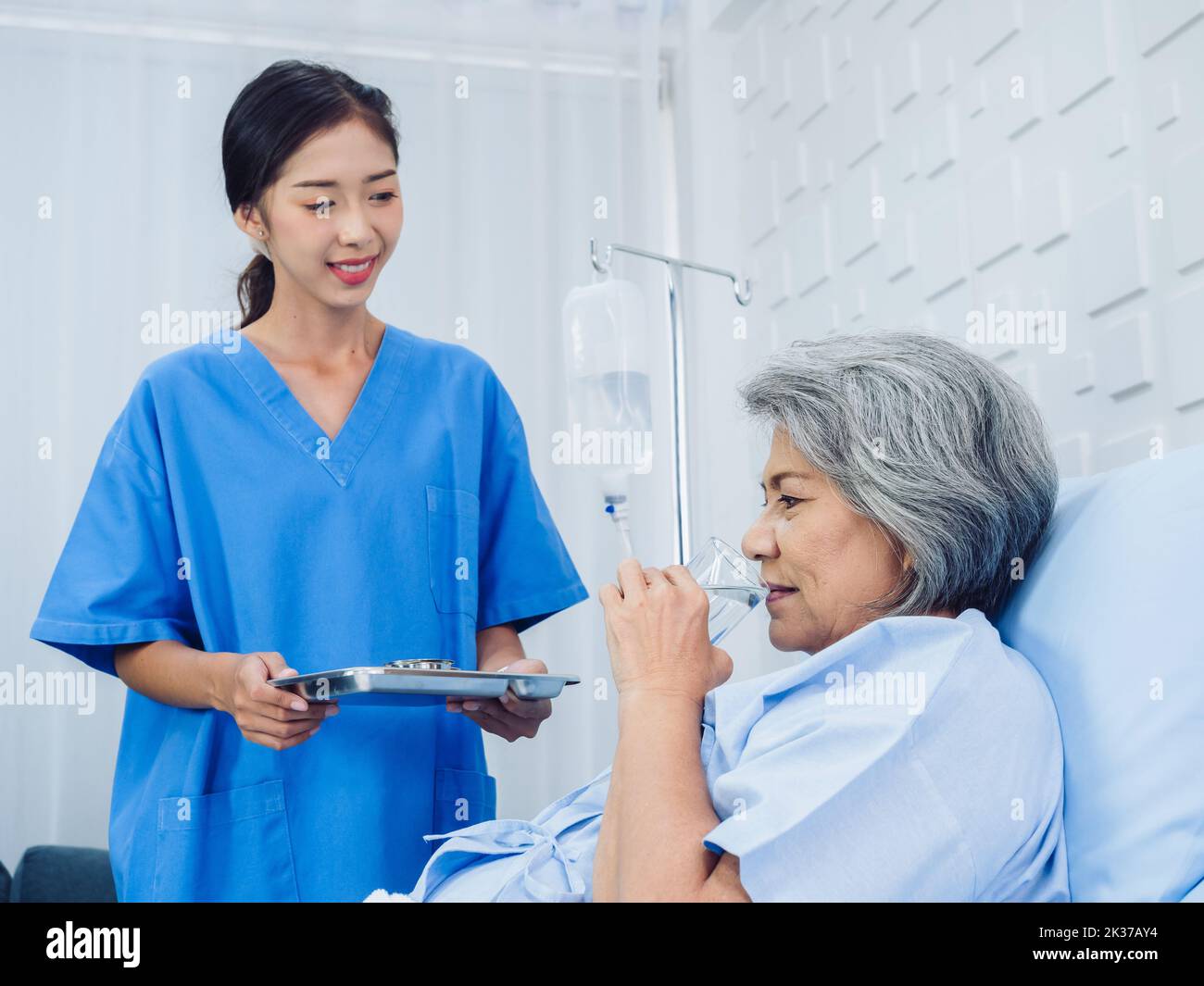 Patient drinking water hospital hi-res stock photography and images - Alamy