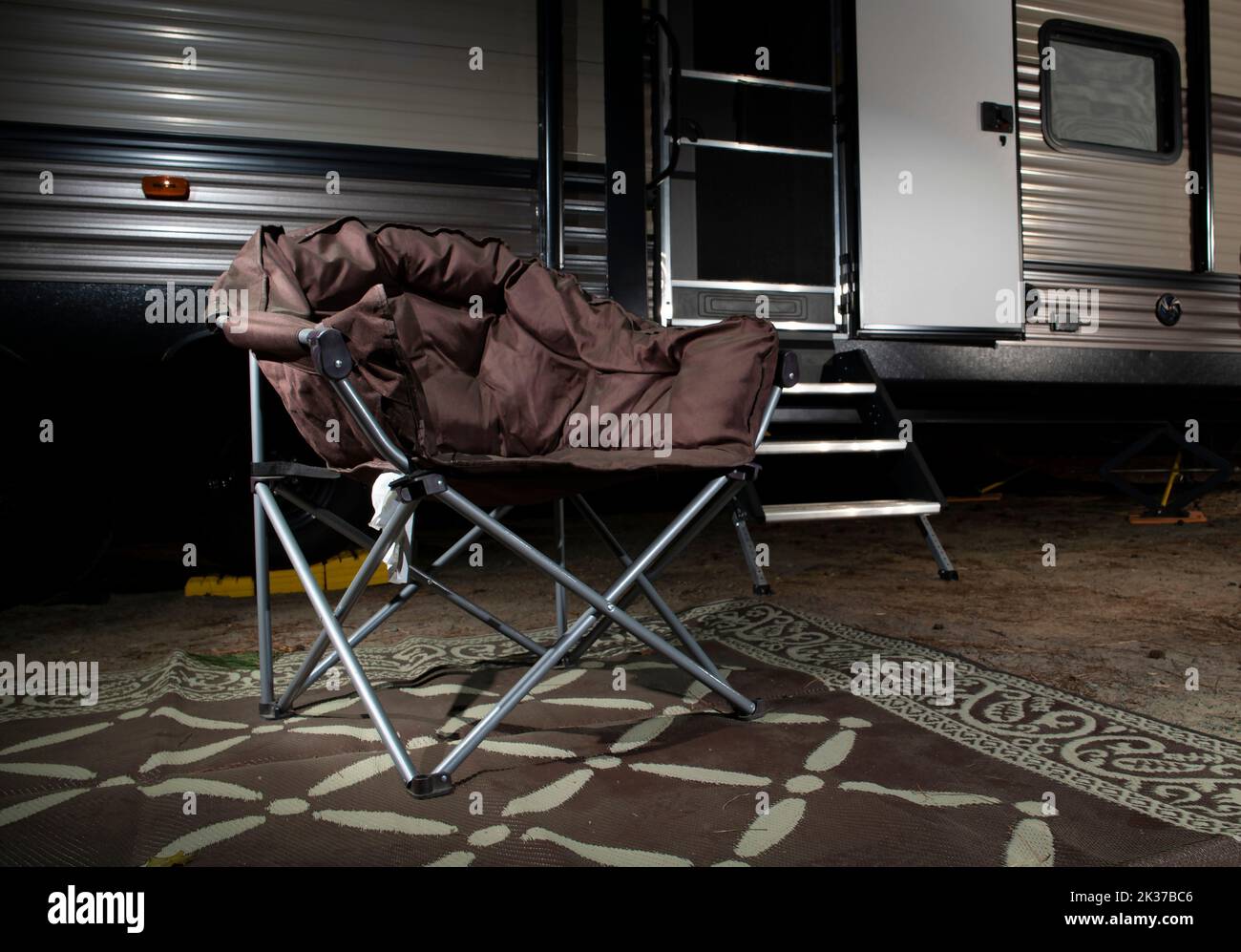 RV campsite with an empty chair at night at Jordan Lake Stock Photo - Alamy