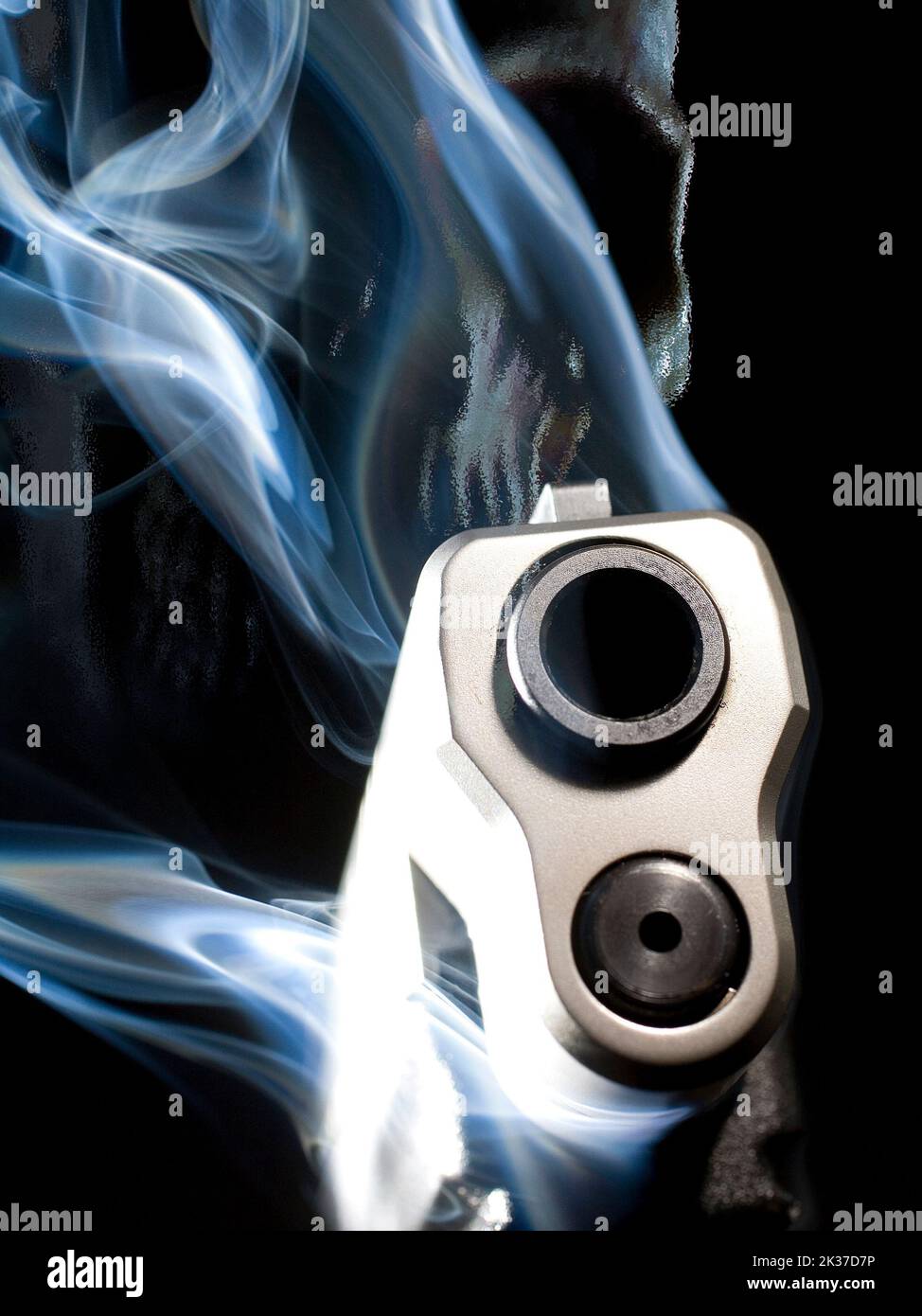 3D rendering of a ghost gun with smoke rising from the barrel and skull ...