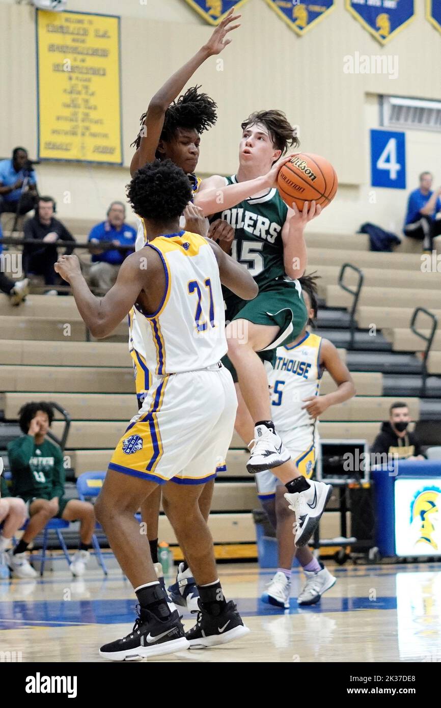 A vertical shot of Lighthouse and Oilers basketball players playing on ...