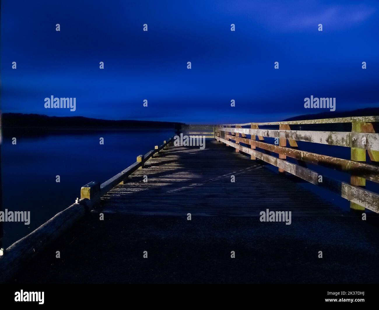 Illuminated wooden pier night hi-res stock photography and images - Alamy