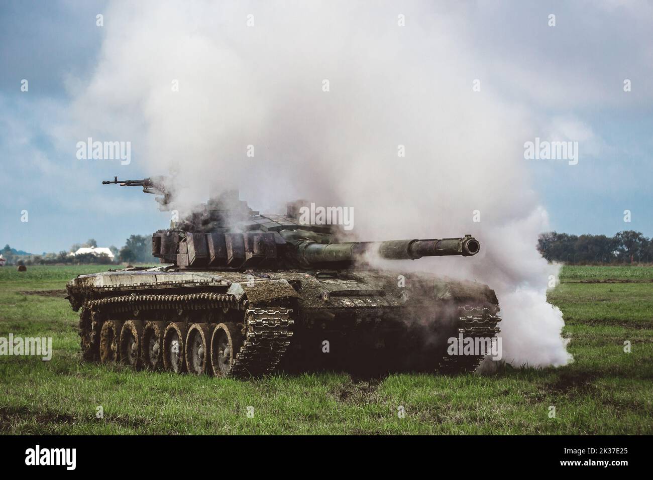A scenic view of a tank releasing a smoke screen during simulated ...