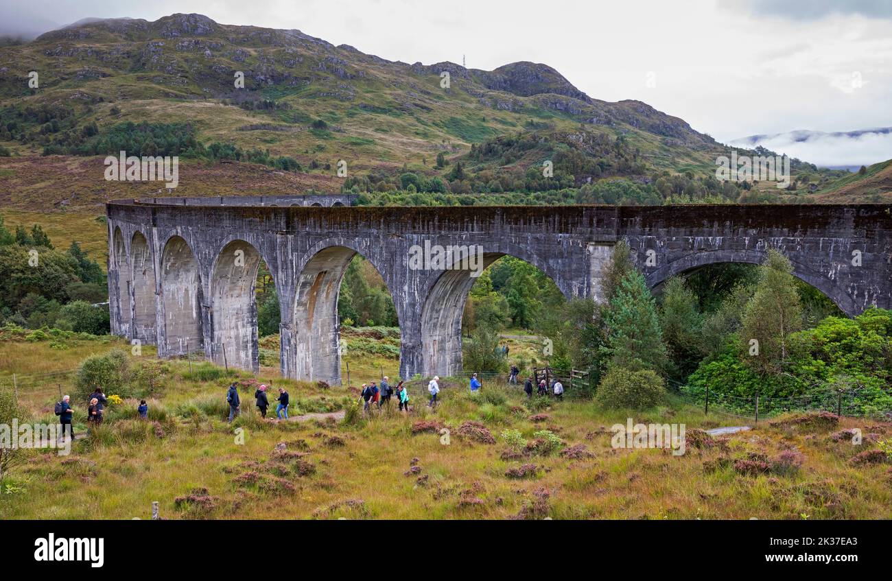 Tourists leave the hill above the Glenifinnan Viaduct, Lochaber ...
