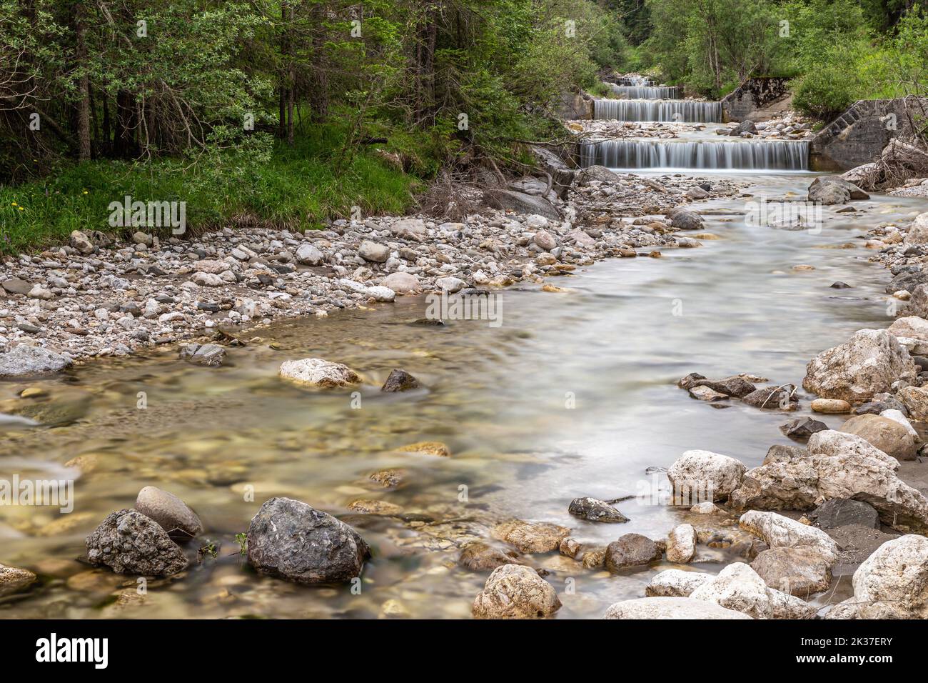 Peaceful mountain stream in the alps of Italian Alta Badia Stock Photo ...