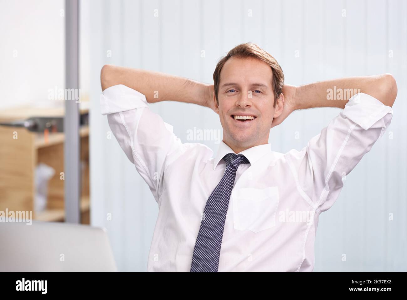 I feel at home here. Portrait of a handsome businessman taking a break ...