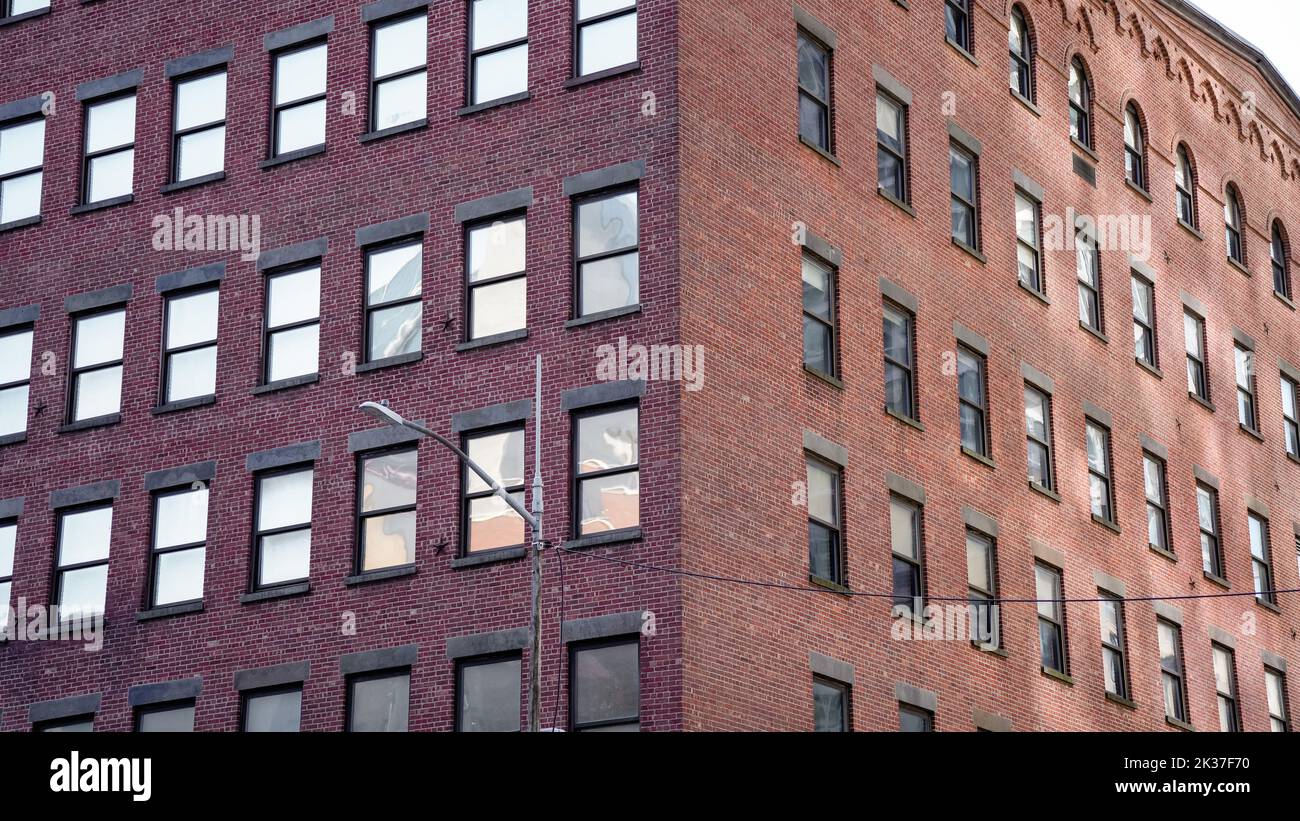 A building with many glass window Stock Photo - Alamy