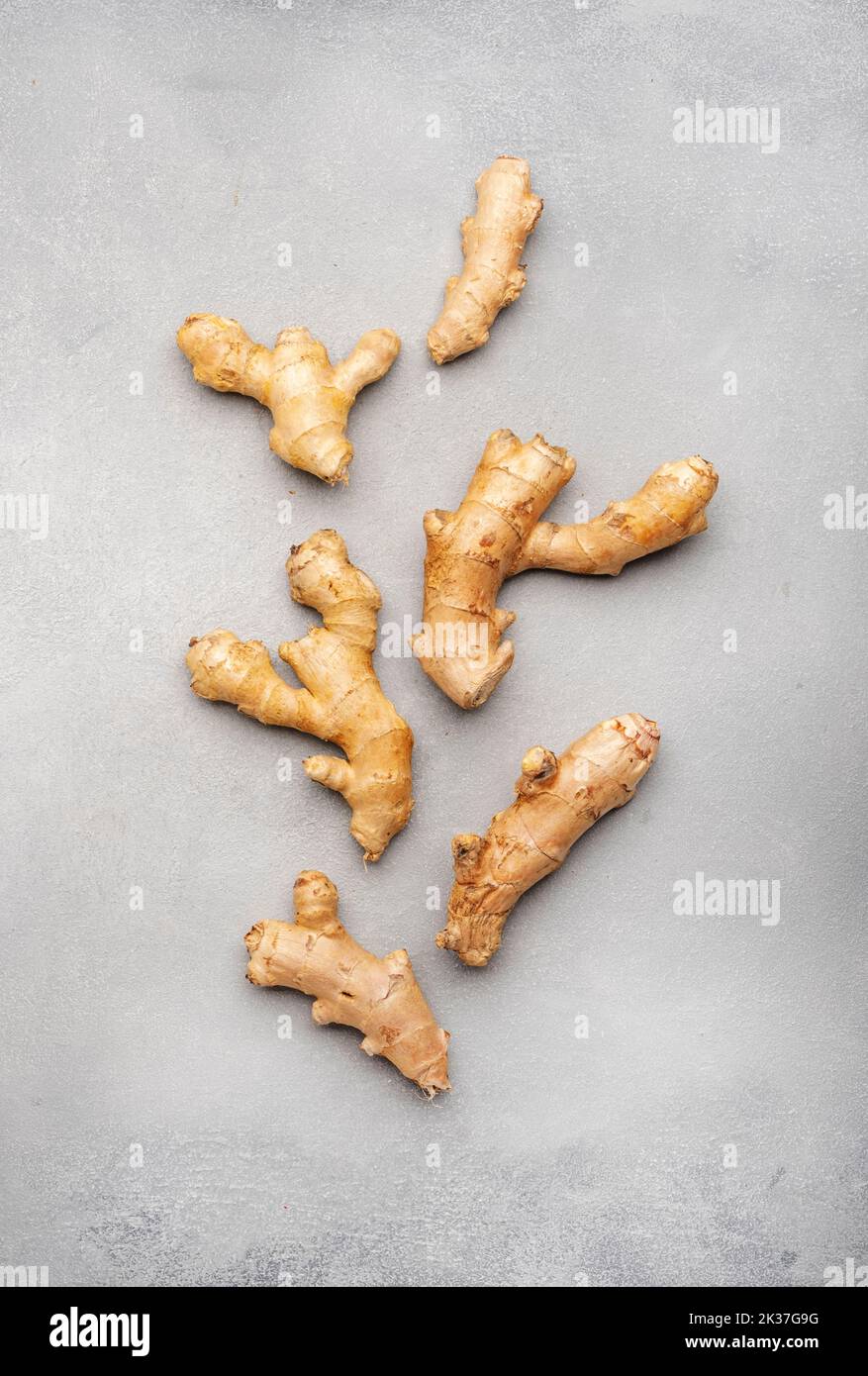 Fresh ginger root. Gray kitchen table background, top view Stock Photo ...