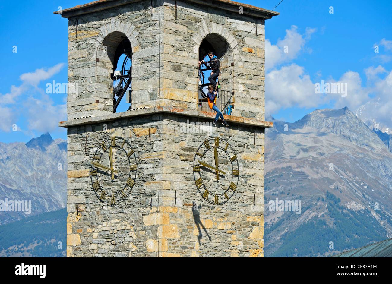 Test of courage, children slide down a zip line from the church tower ...