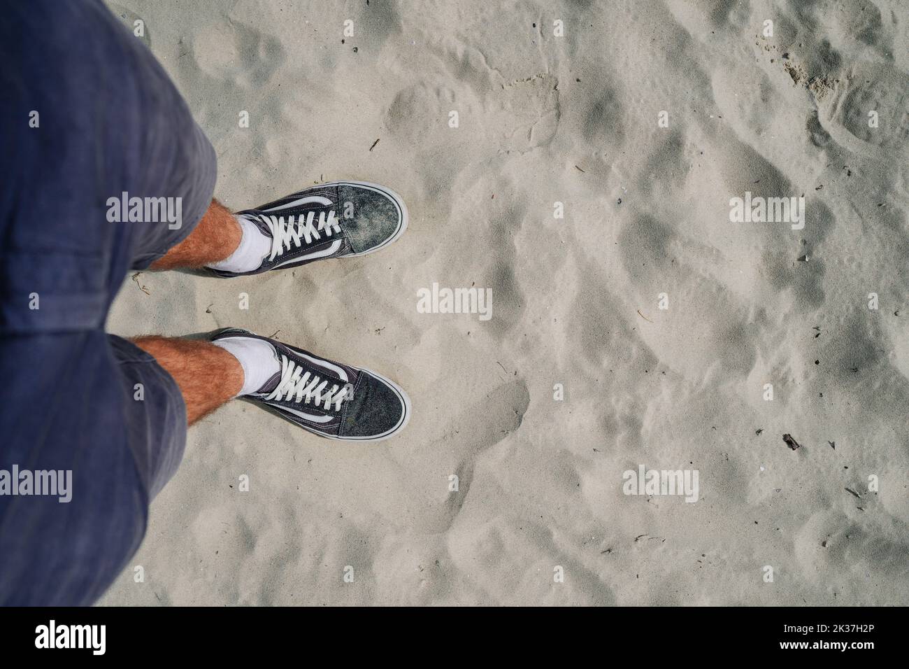 A top view of shoes standing on the sand with copy space Stock Photo ...